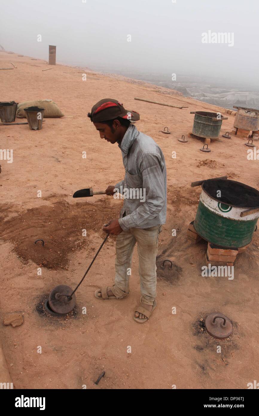 Bangladeshi daily laborers working winter morning in a brickfield at ...