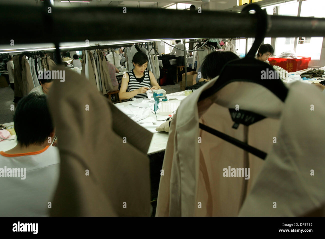 Jun 23, 2006; Shenzhen, CHINA; Sewers work at a garment factory on June ...