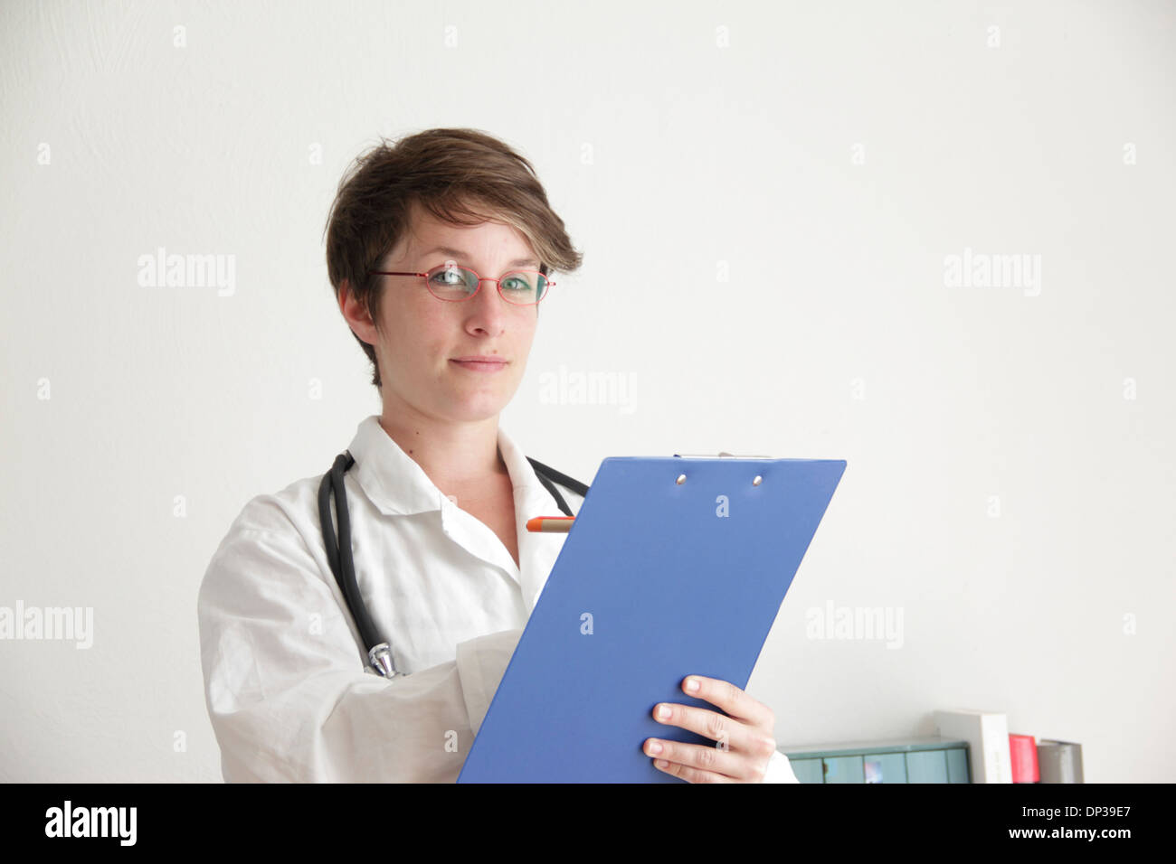 Doctor taking notes Stock Photo - Alamy