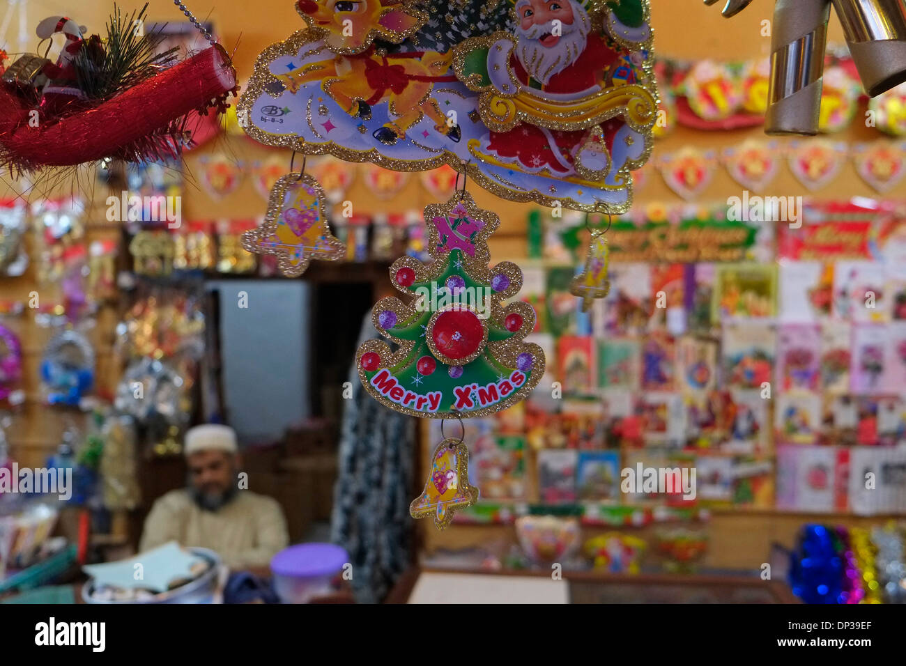 Muslim vendor selling Christmas decorations in a shop in the Island of ...