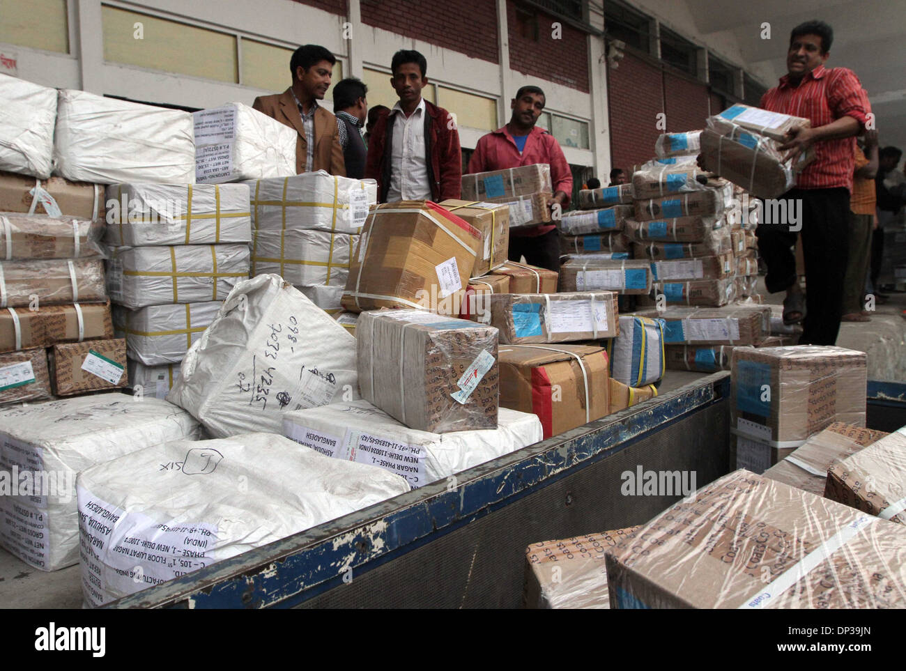 Workers unloading import material of Biman cargo complex on Hazrat ...