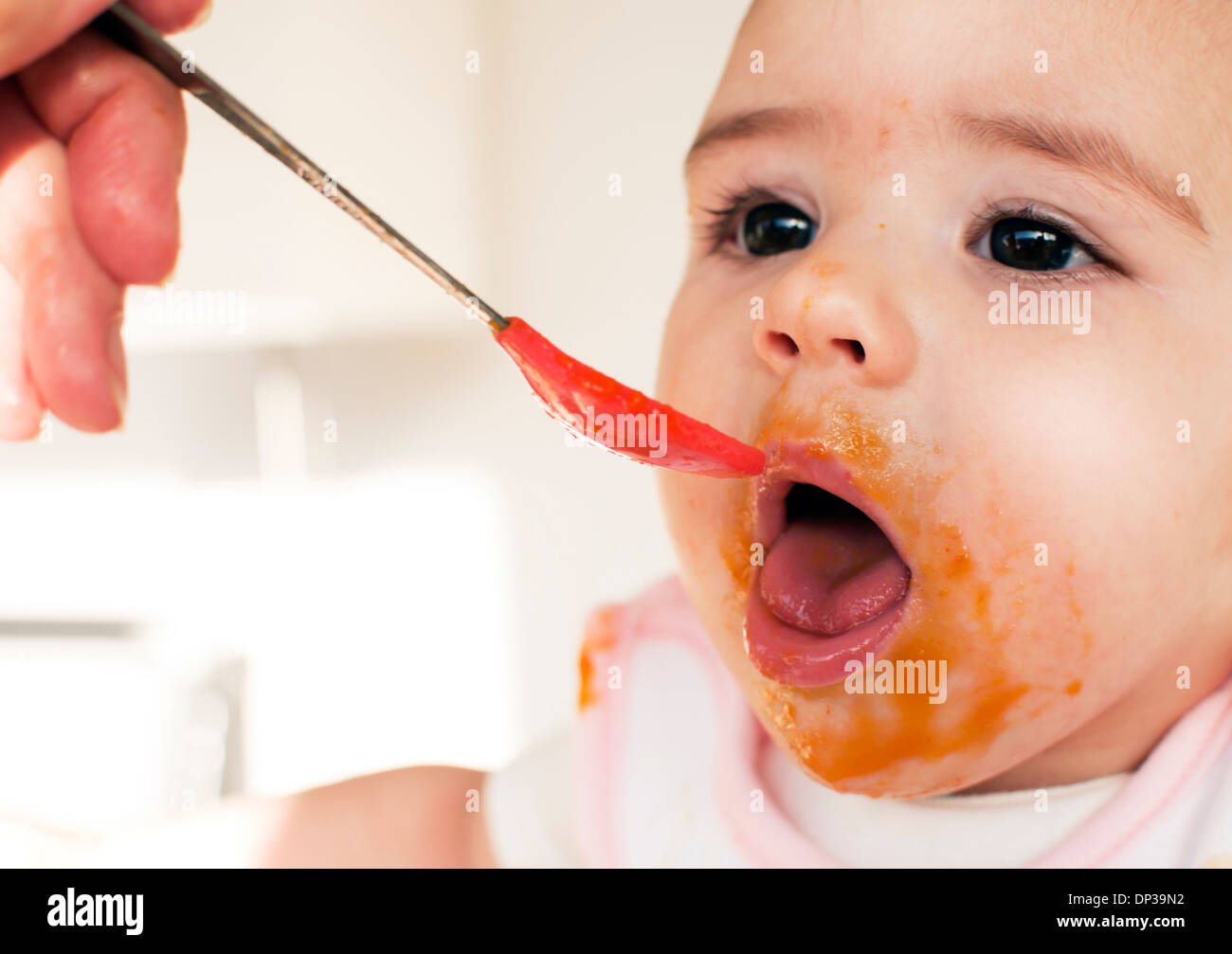 Baby eating messy face hi-res stock photography and images - Alamy