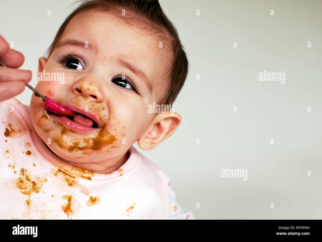 Messy face baby eating hi-res stock photography and images - Alamy