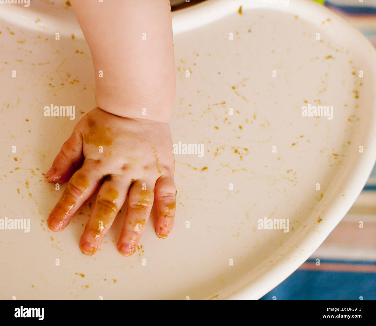 Messy baby hand Stock Photo - Alamy