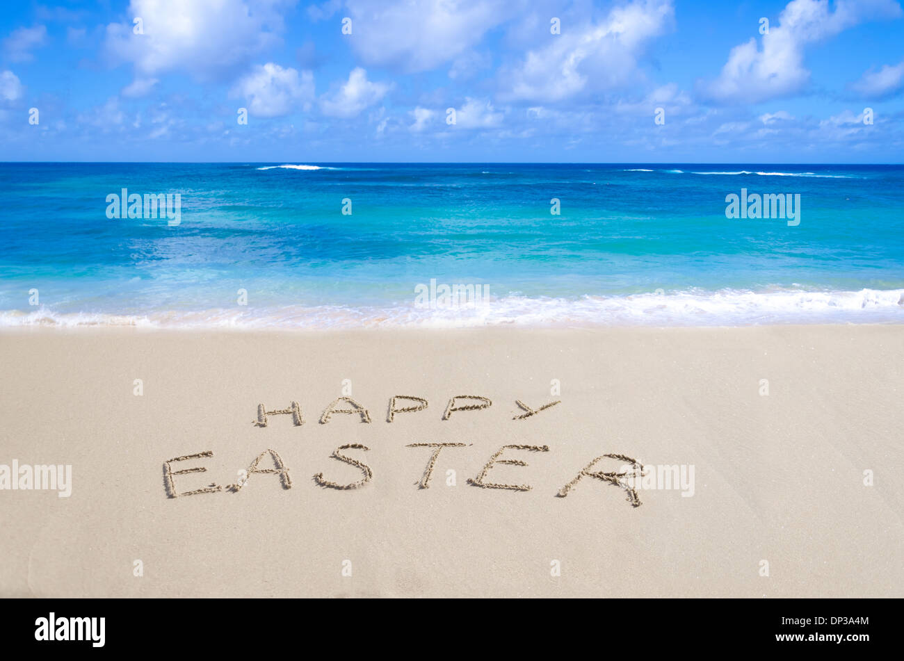 Sign "Happy Easter" on the sandy beach by the ocean Stock Photo - Alamy