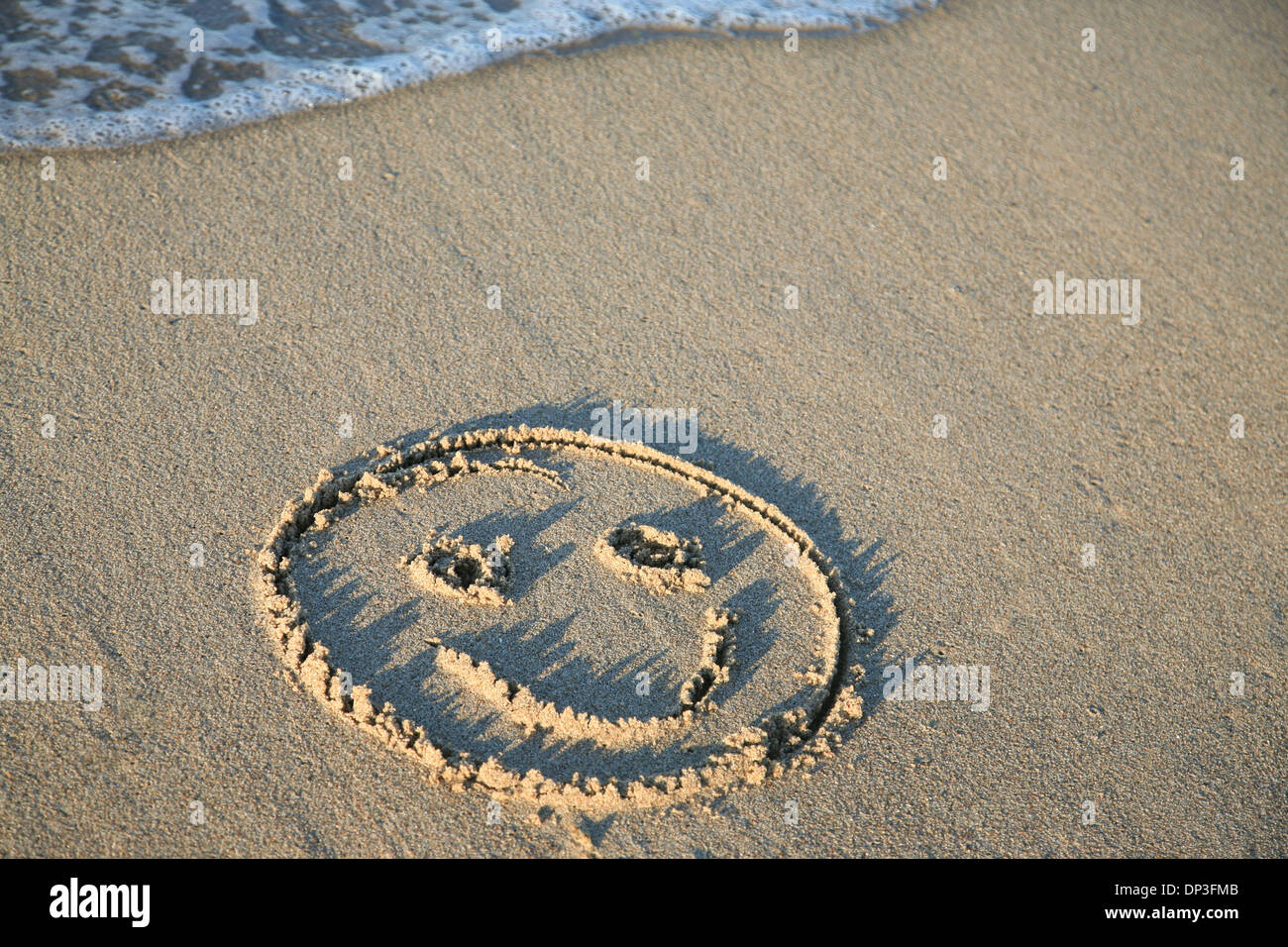 Smiling face on the beach Stock Photo - Alamy
