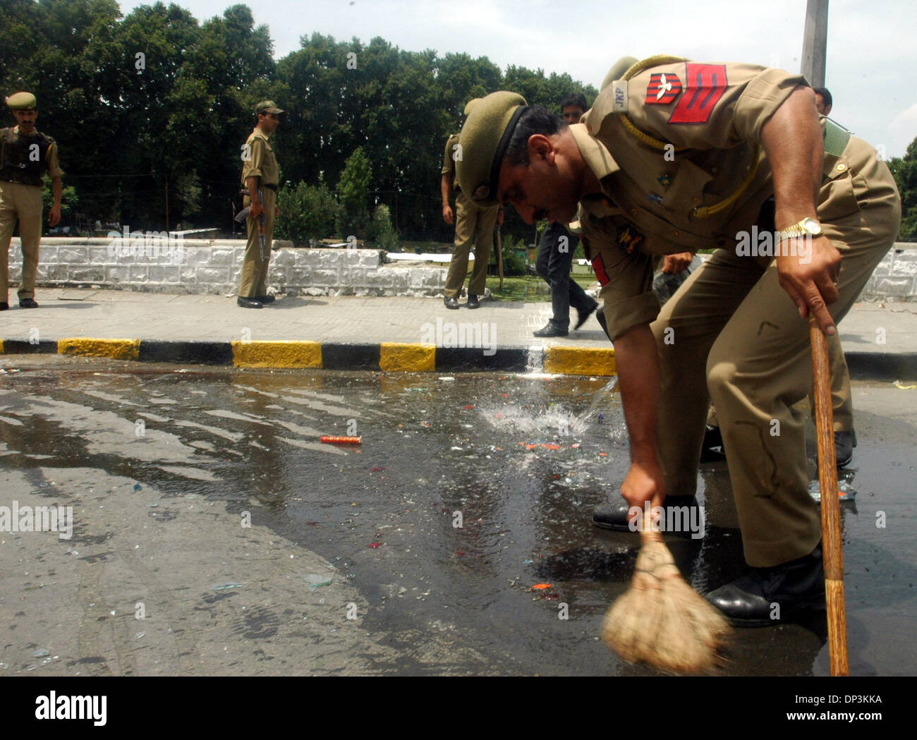 Jul 11, 2006; Srinagar, Kashmir, INDIA; Police washing off the blood ...