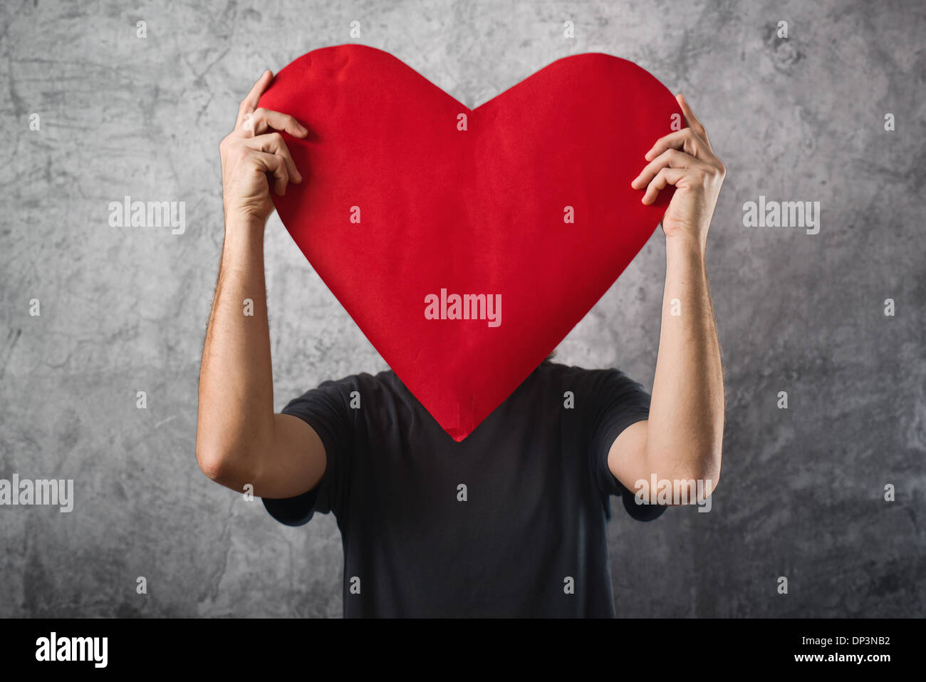 Man holding object in front of face hi-res stock photography and images ...