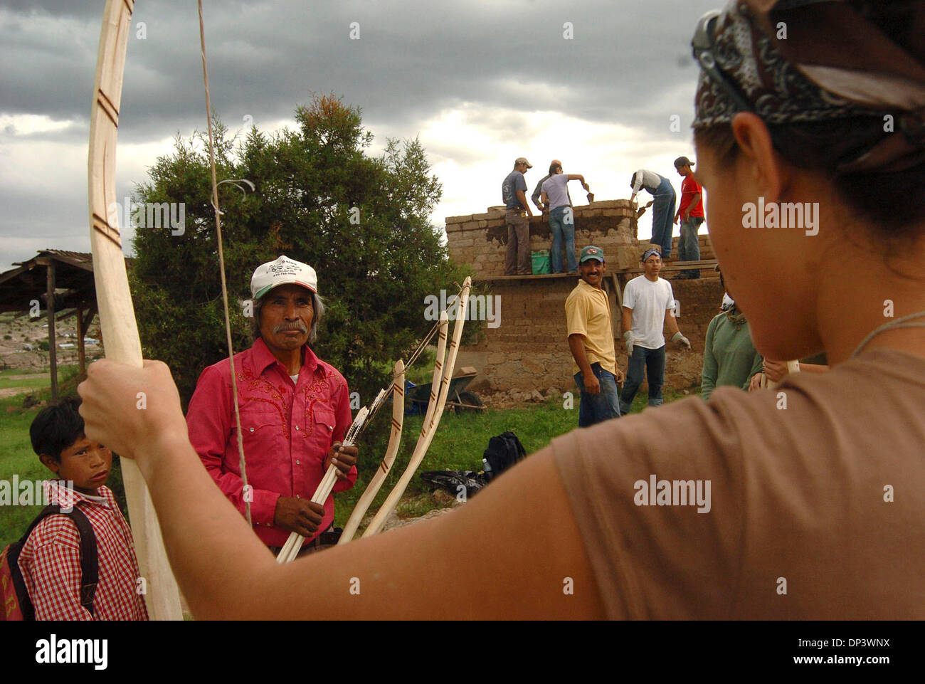 Jul 18, 2006; Norogachi, MEXICO; A Tarahumara and his son offer bows ...