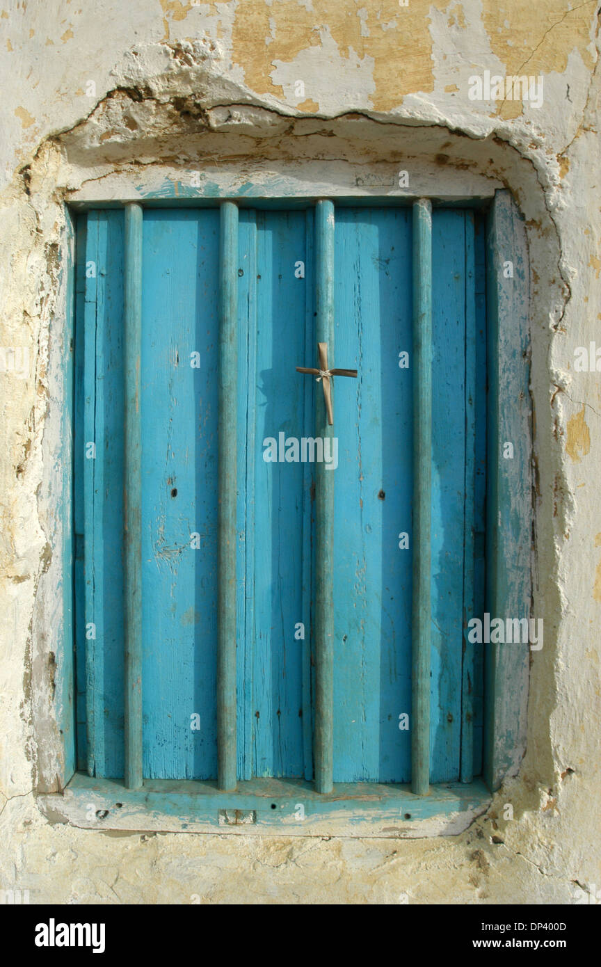 A blue window decorates a mud house in Paraguana Peninsula, Falcon ...