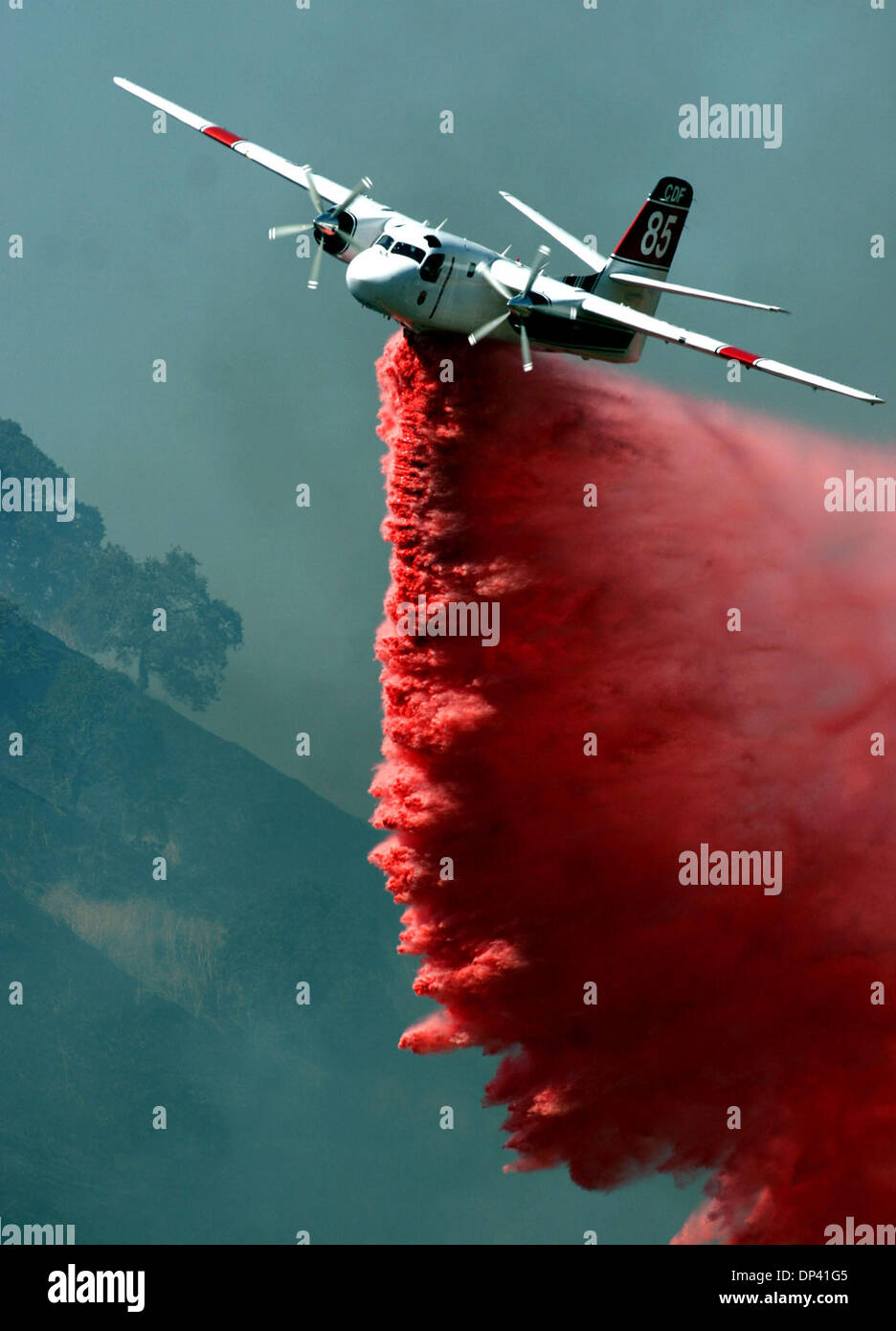 Jul 20, 2006; Hercules, CA, USA; A CDF plane drops fire retardent on a ...