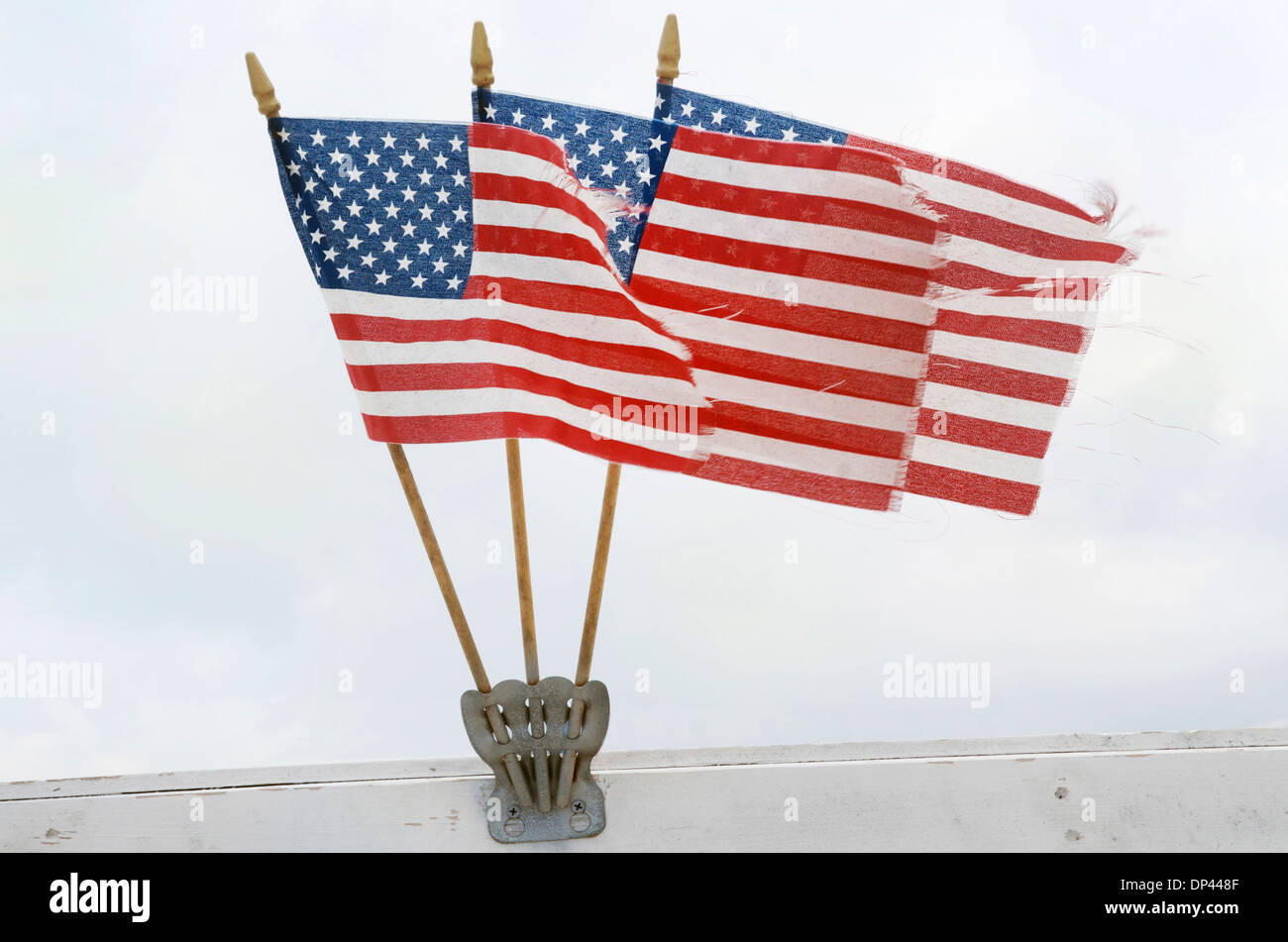 Three American flags blowing in the wind Stock Photo - Alamy