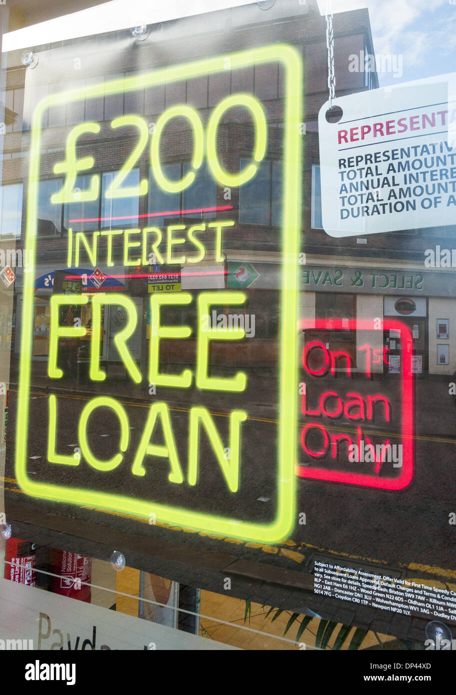 Neon sign in a high street shop window advertising a £200 interest free ...