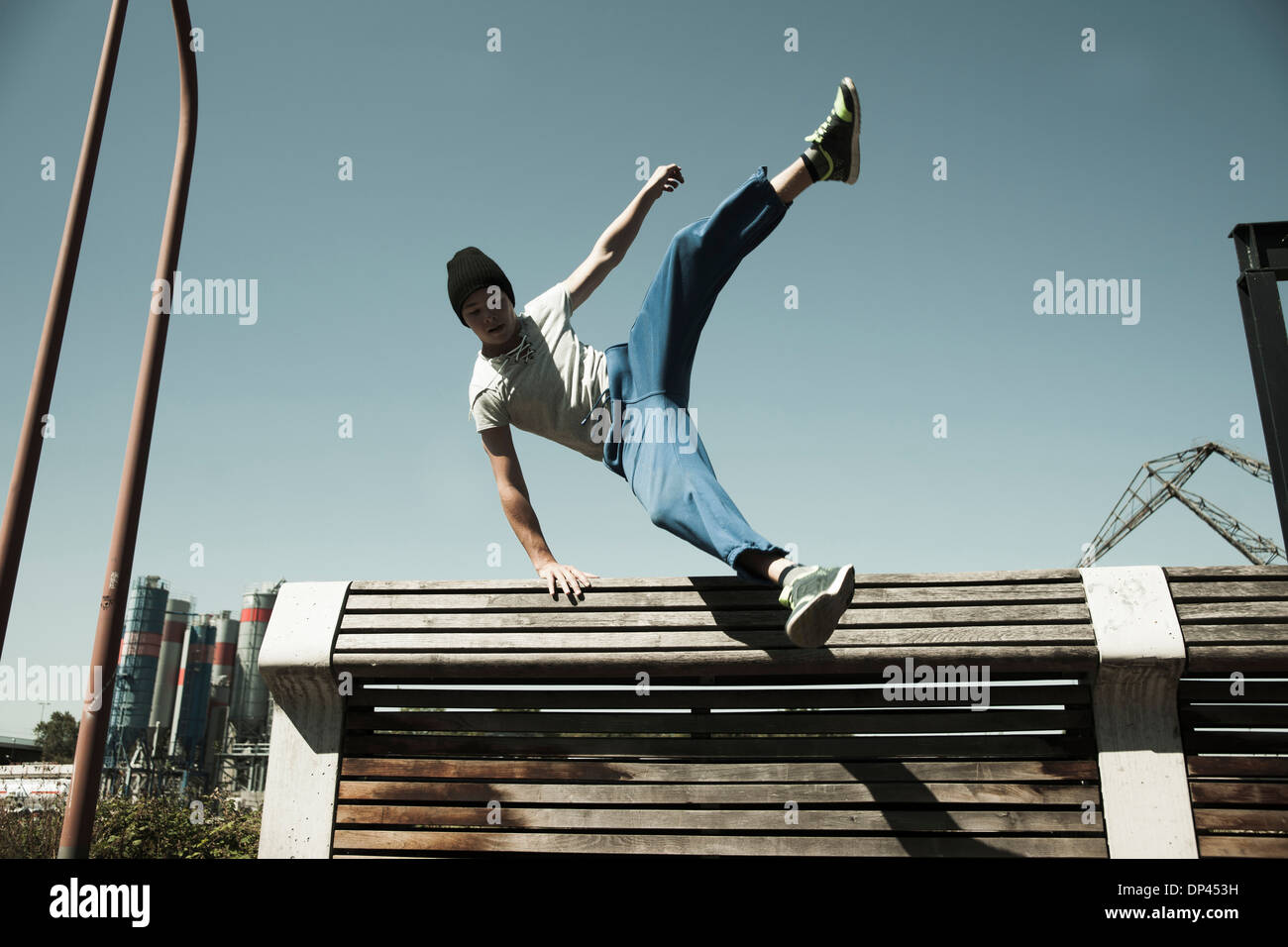 Teenaged boy jumping over barrier, freerunning, Germany Stock Photo - Alamy