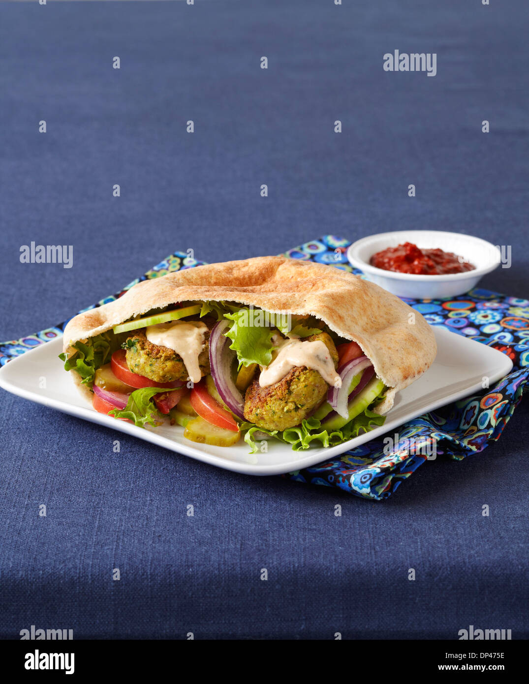 Falafel Sandwich in Pita with Tahini Sauce, Blue Background, Studio ...