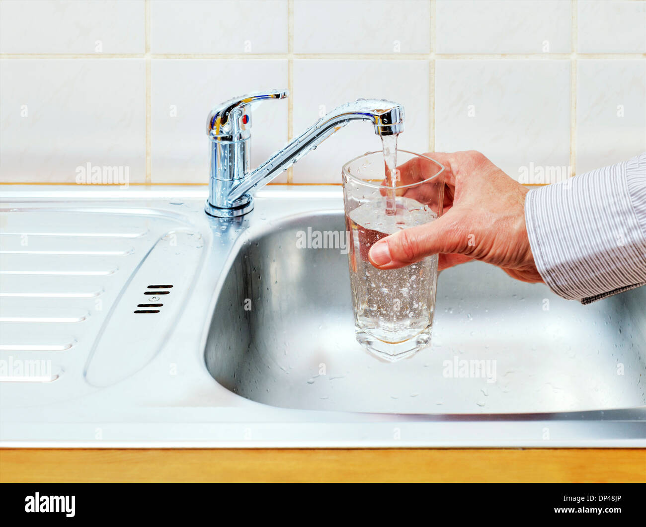 Pouring glass of tap water Stock Photo - Alamy