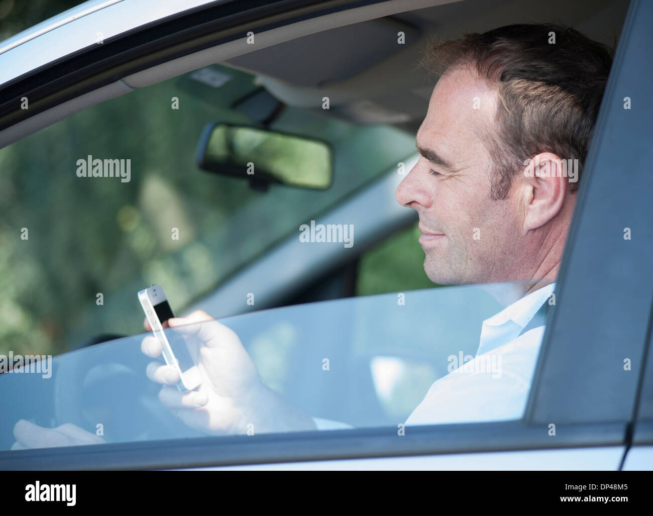 Businessman using Cell Phone while Driving, Mannheim, Baden-Wurttemberg ...