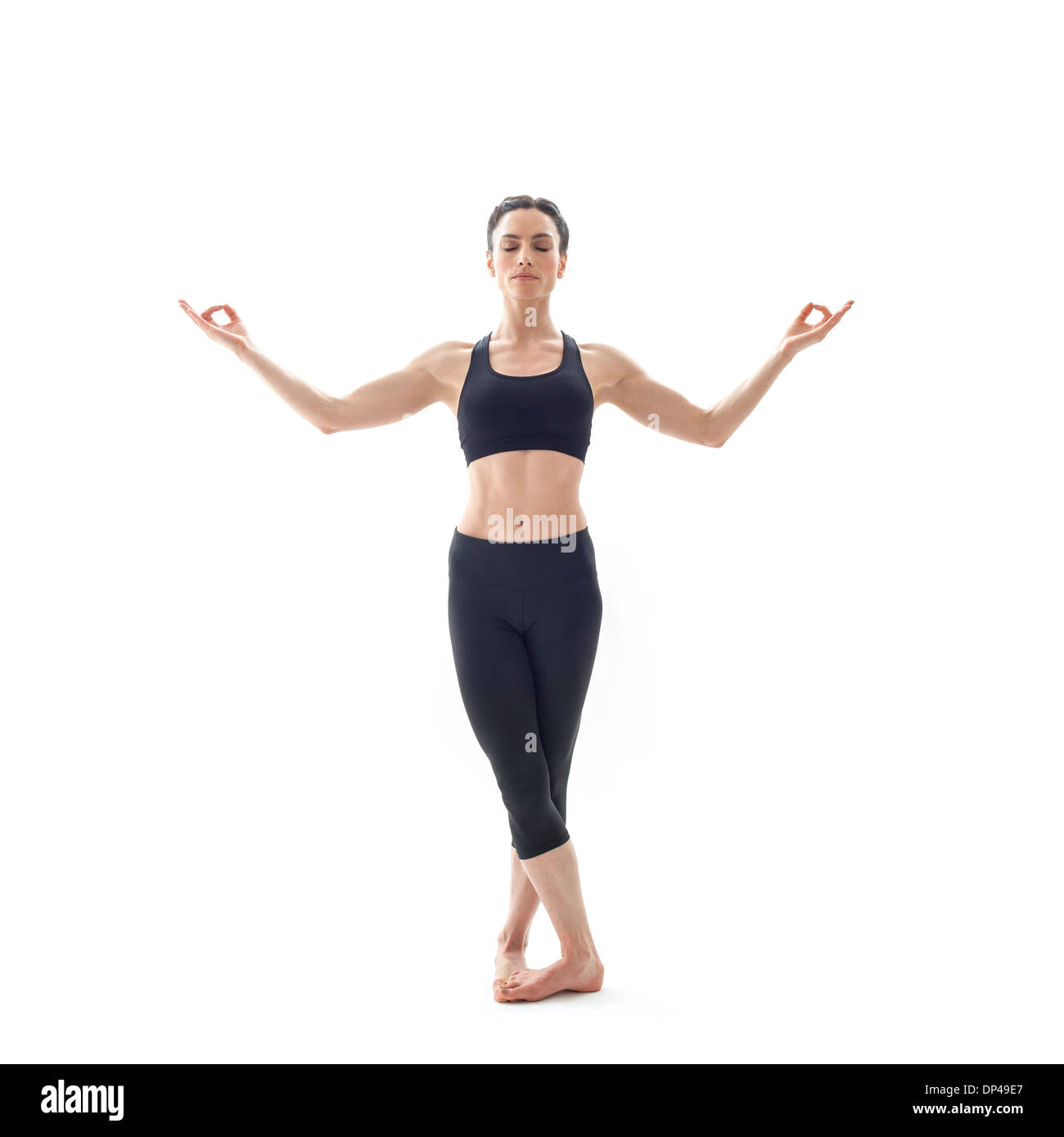 Woman practicing yoga Stock Photo - Alamy