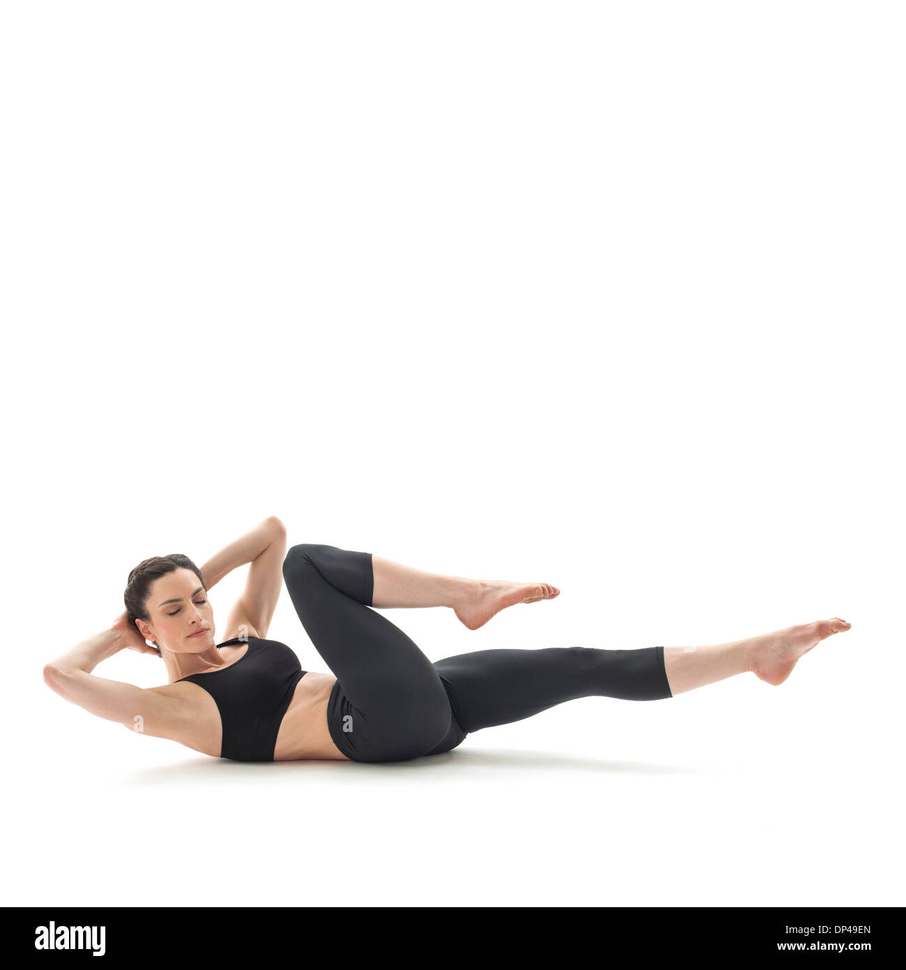 Woman doing abdominal crunches exercise hi-res stock photography and ...