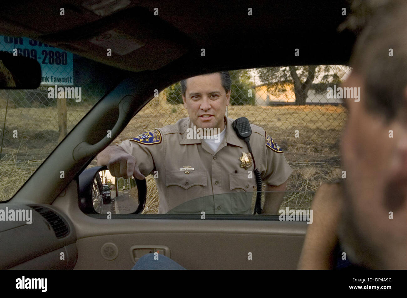 Aug 02, 2006; Sacramento, CA, USA; CHP officer Steve Merchant talks to ...