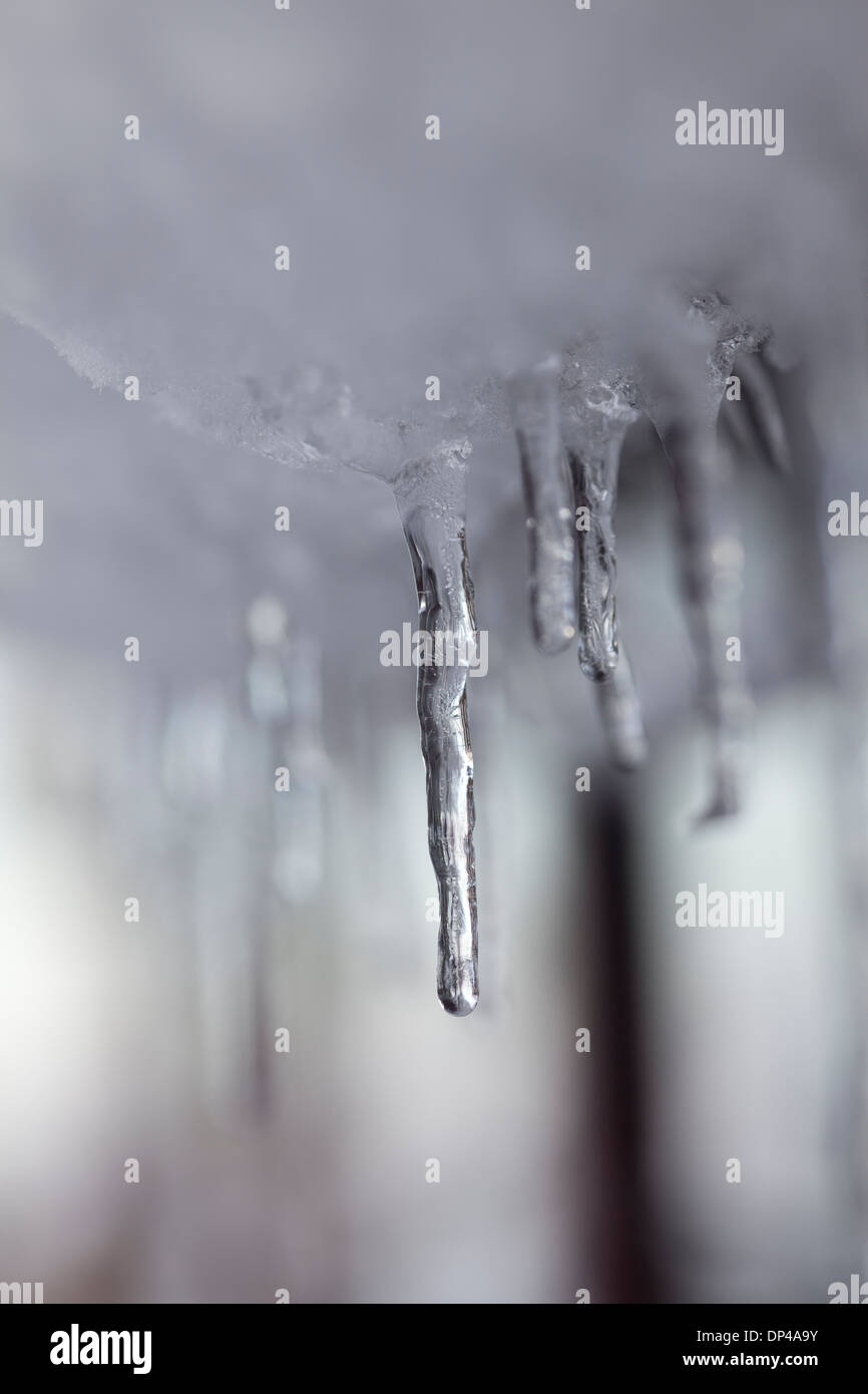 Icicles hanging from snow on a window frame Stock Photo - Alamy