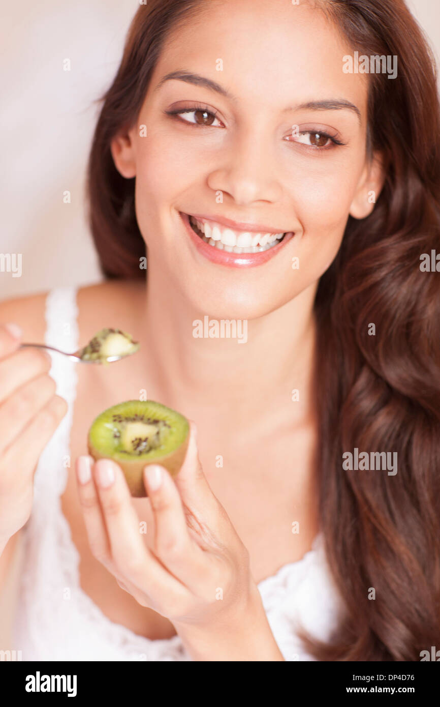 Woman eating fruit Stock Photo - Alamy
