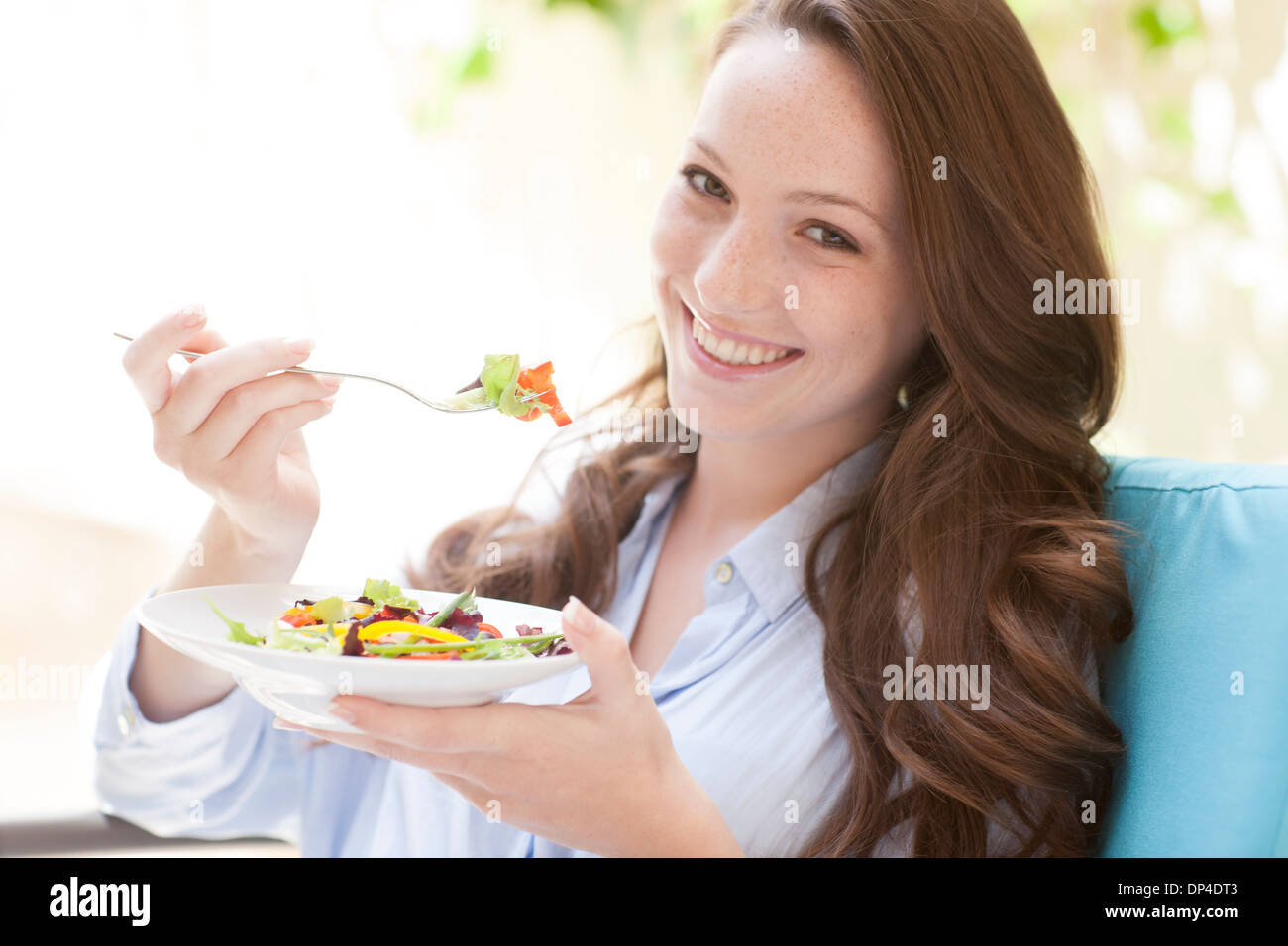 Woman eating salad outdoors hi-res stock photography and images - Alamy