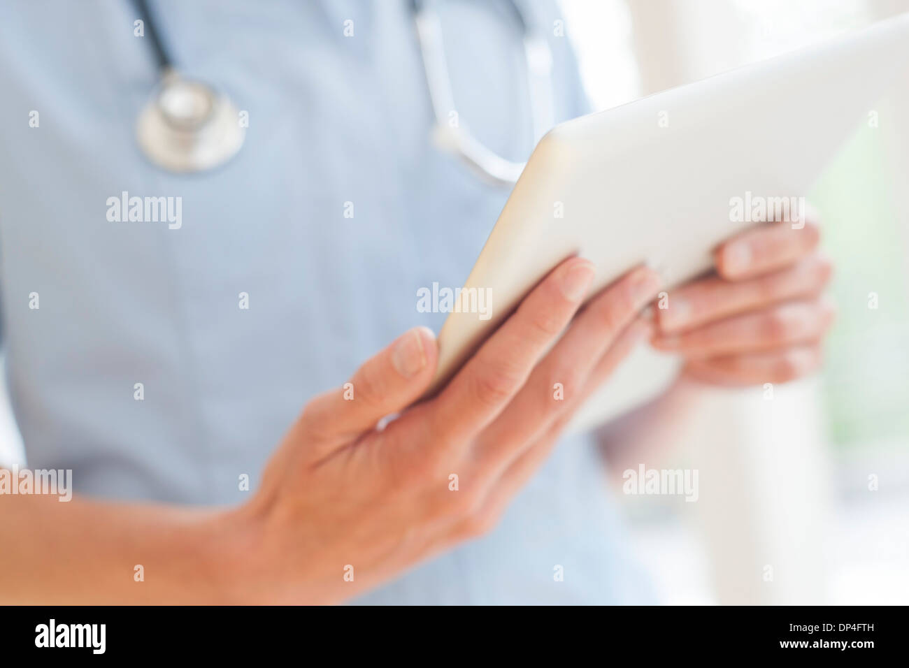 Nurse using a tablet computer Stock Photo - Alamy