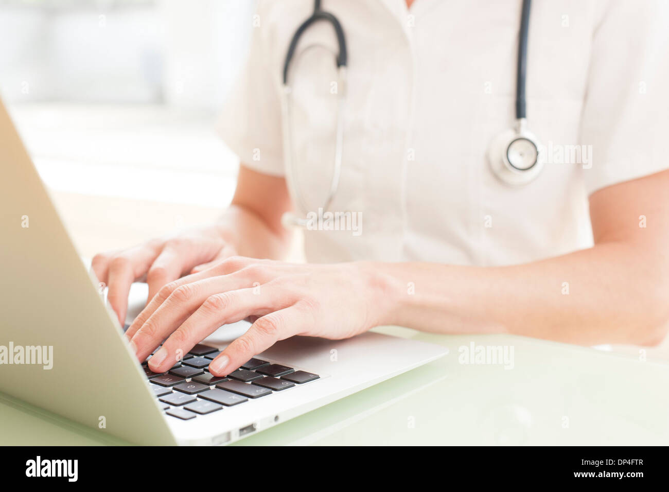 Nurse using a laptop computer Stock Photo - Alamy