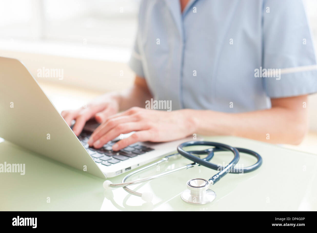 Nurse using a laptop computer Stock Photo - Alamy