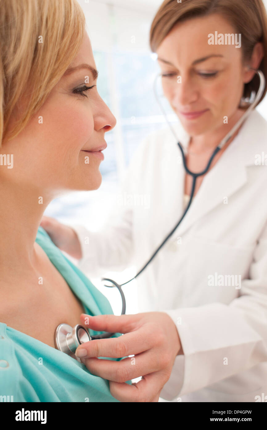 Doctor holding up chest hi-res stock photography and images - Alamy