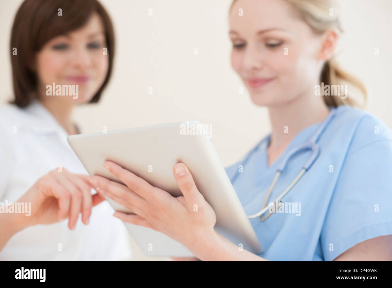 Two people looking at a computer hi-res stock photography and images ...