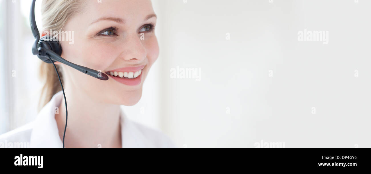 Doctor using a headset Stock Photo - Alamy