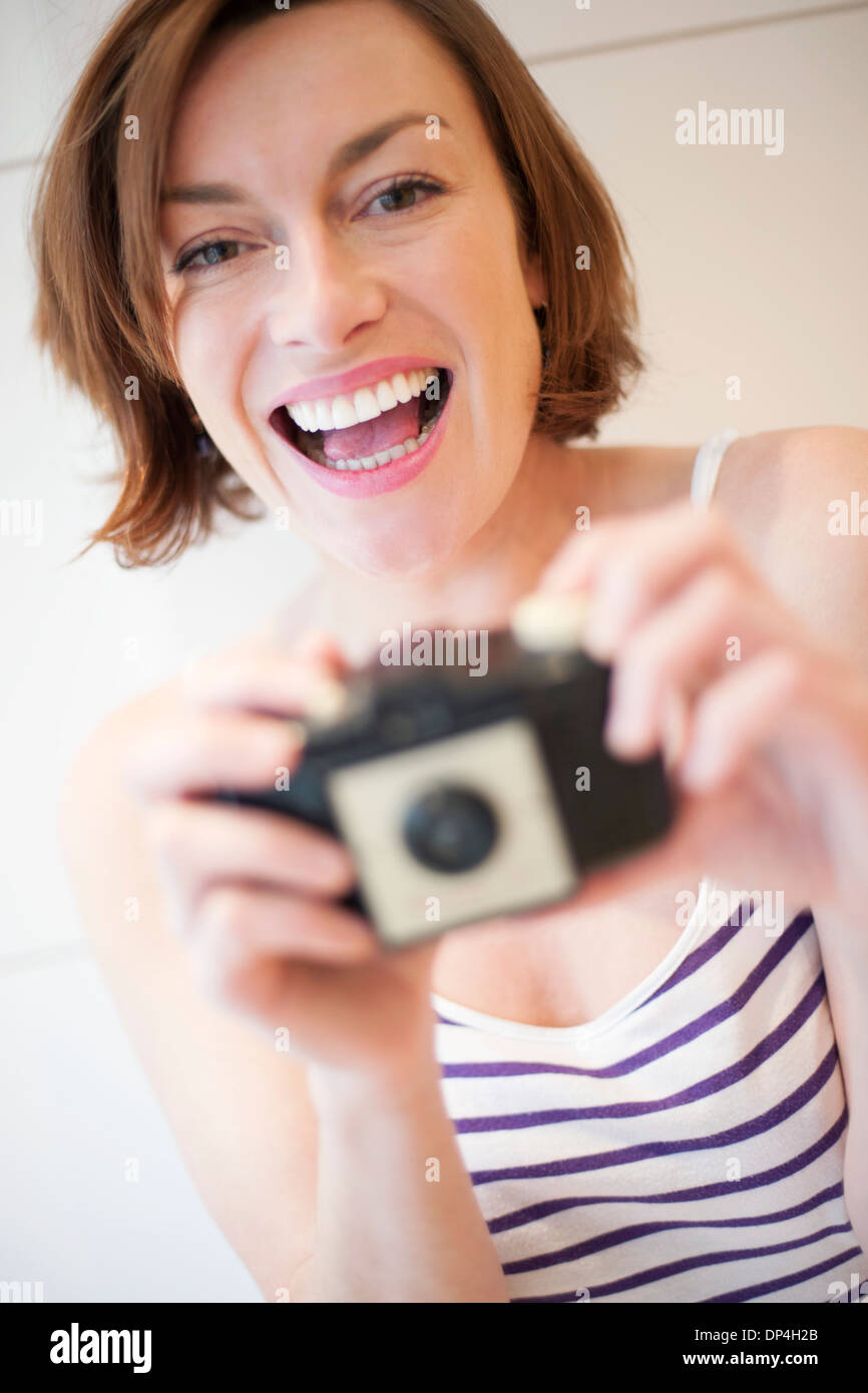Woman taking photograph Stock Photo - Alamy