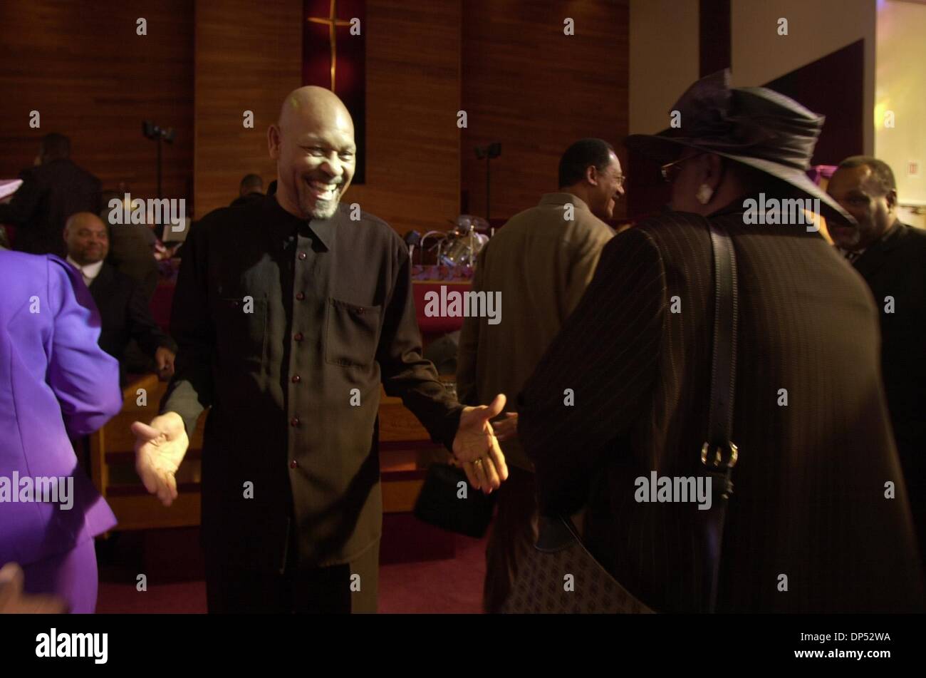 (Published 8/12/2004, E-5) Pastor Timothy J. Winters greets and blesses ...