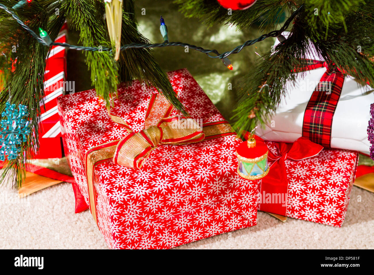 Christmas presents wrapped in colorful paper Stock Photo - Alamy