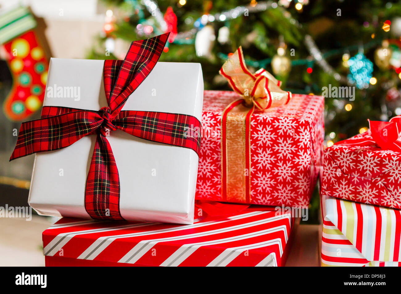 Christmas presents wrapped in colorful paper Stock Photo - Alamy