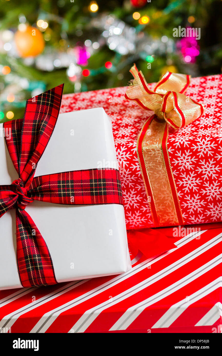 Christmas presents wrapped in colorful paper Stock Photo - Alamy
