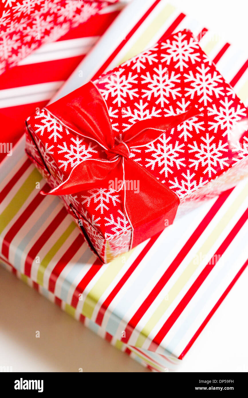 Christmas presents wrapped in colorful paper Stock Photo - Alamy