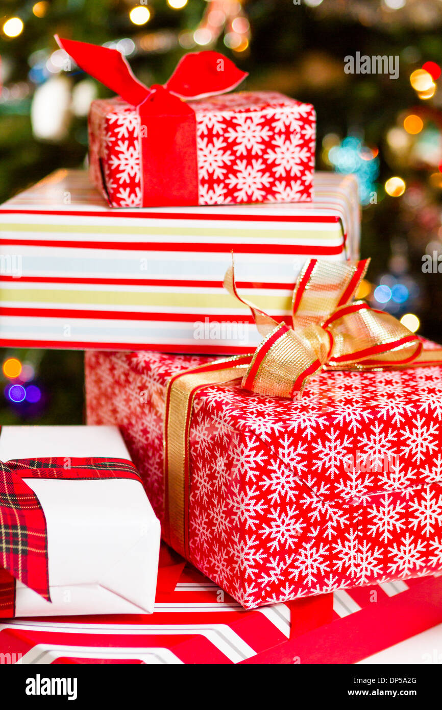 Christmas presents wrapped in colorful paper Stock Photo - Alamy