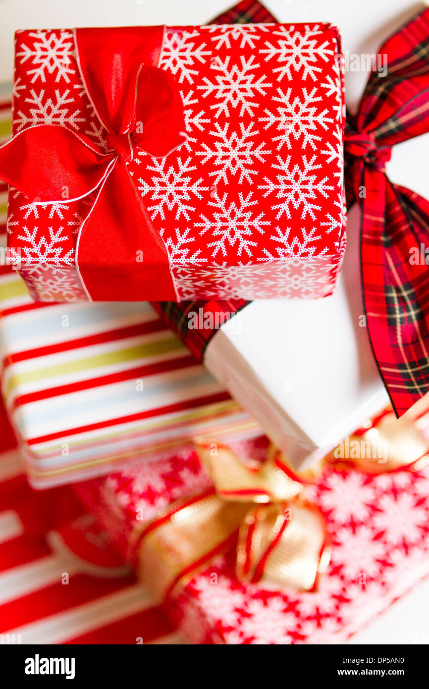Christmas presents wrapped in colorful paper Stock Photo - Alamy