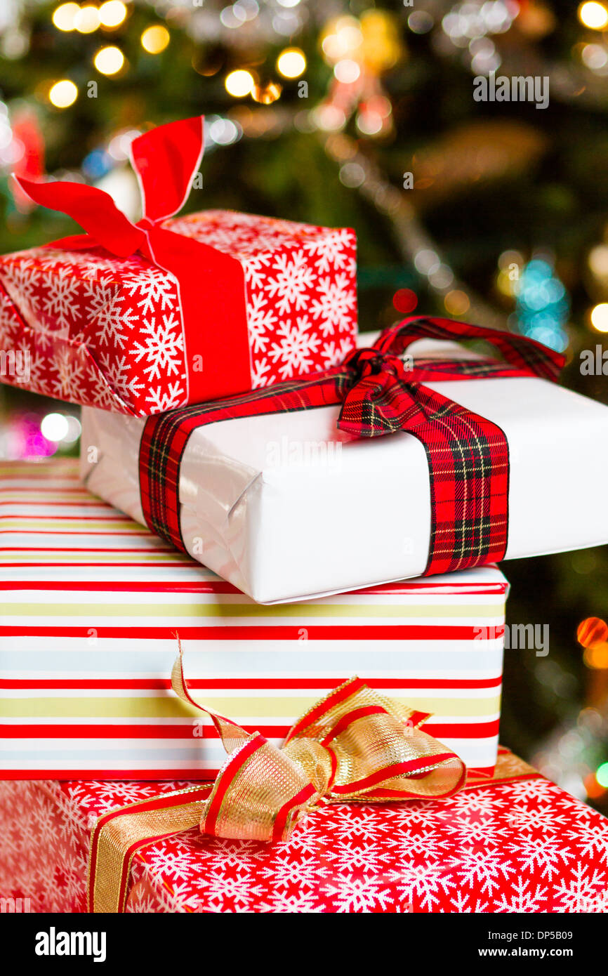 Christmas presents wrapped in colorful paper Stock Photo - Alamy