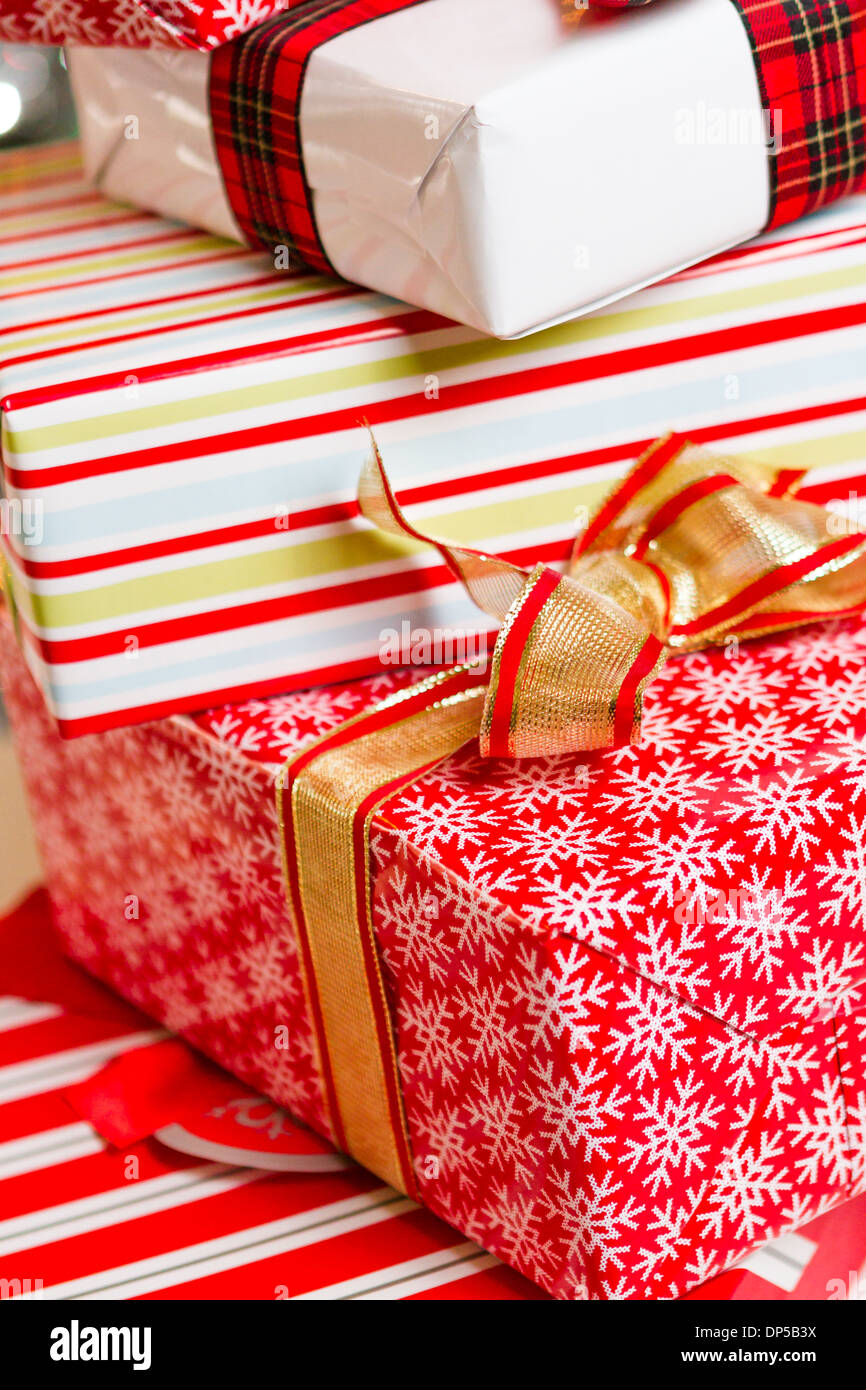 Christmas presents wrapped in colorful paper Stock Photo - Alamy
