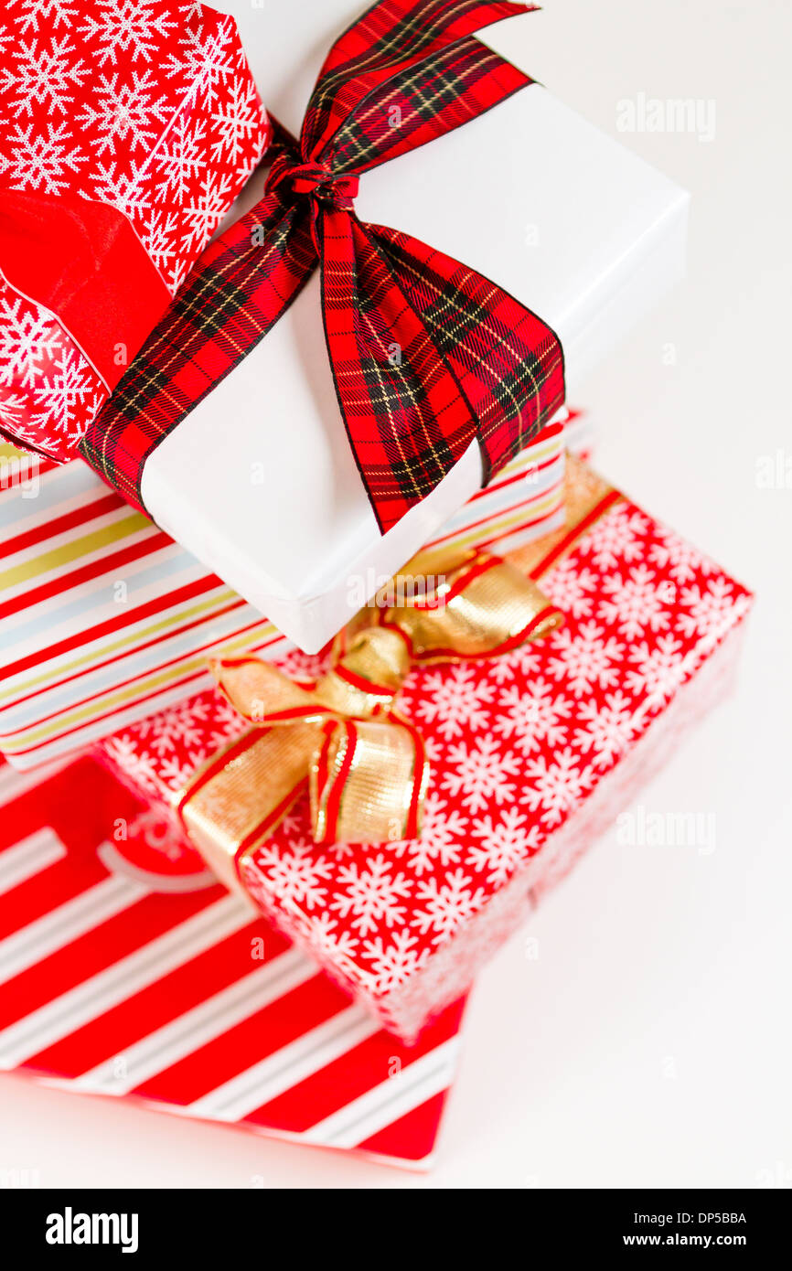 Christmas presents wrapped in colorful paper Stock Photo - Alamy
