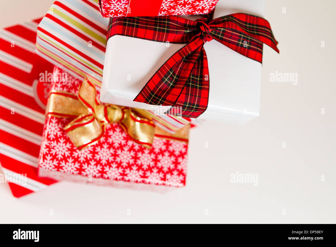 Christmas presents wrapped in colorful paper Stock Photo - Alamy
