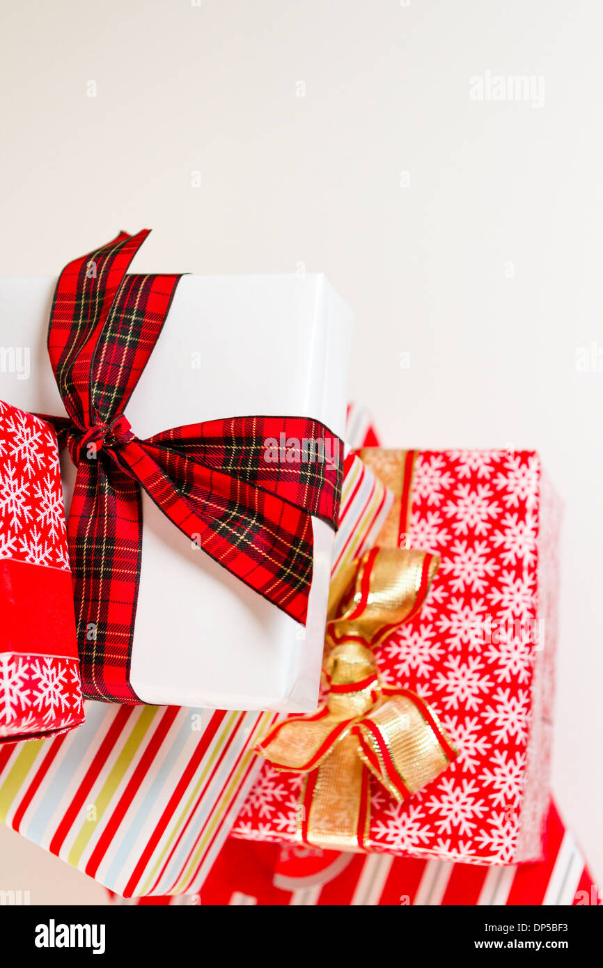 Christmas presents wrapped in colorful paper Stock Photo - Alamy