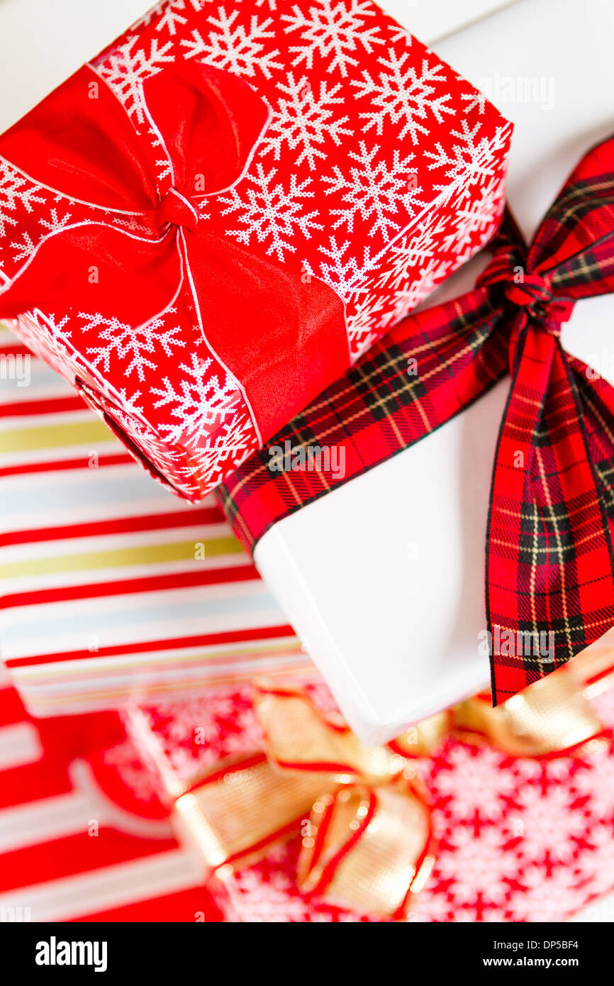 Christmas presents wrapped in colorful paper Stock Photo - Alamy