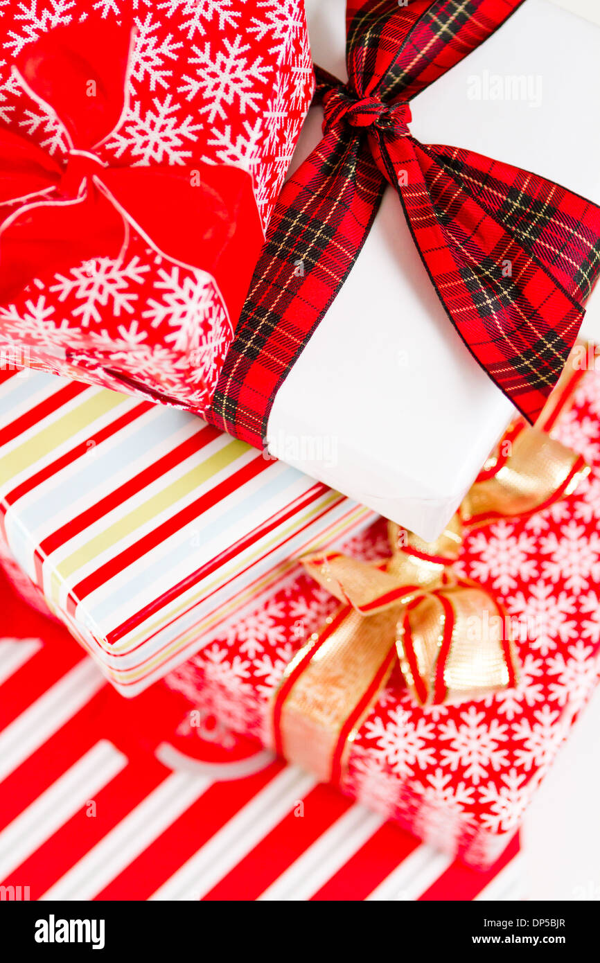 Christmas presents wrapped in colorful paper Stock Photo - Alamy