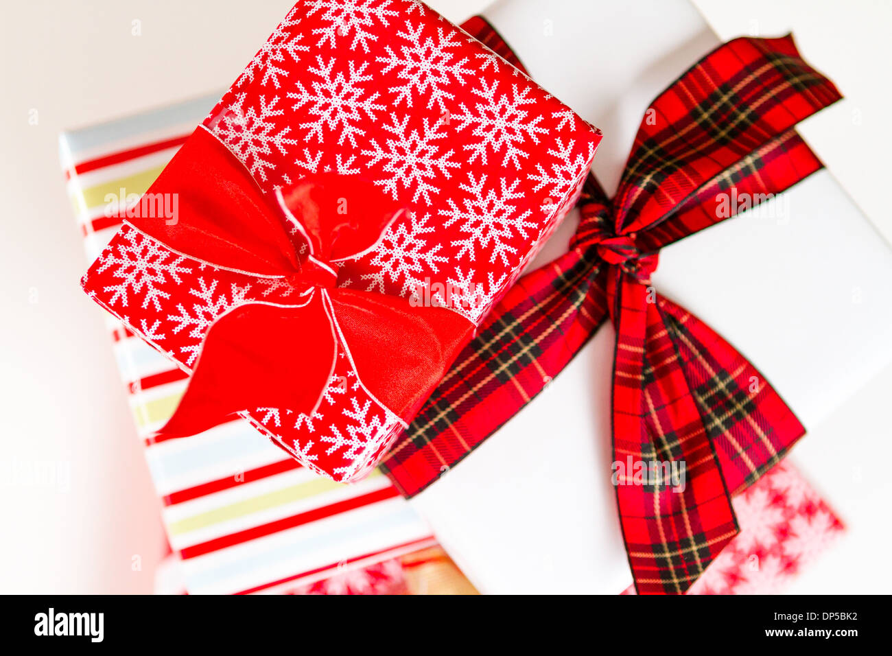 Christmas presents wrapped in colorful paper Stock Photo - Alamy