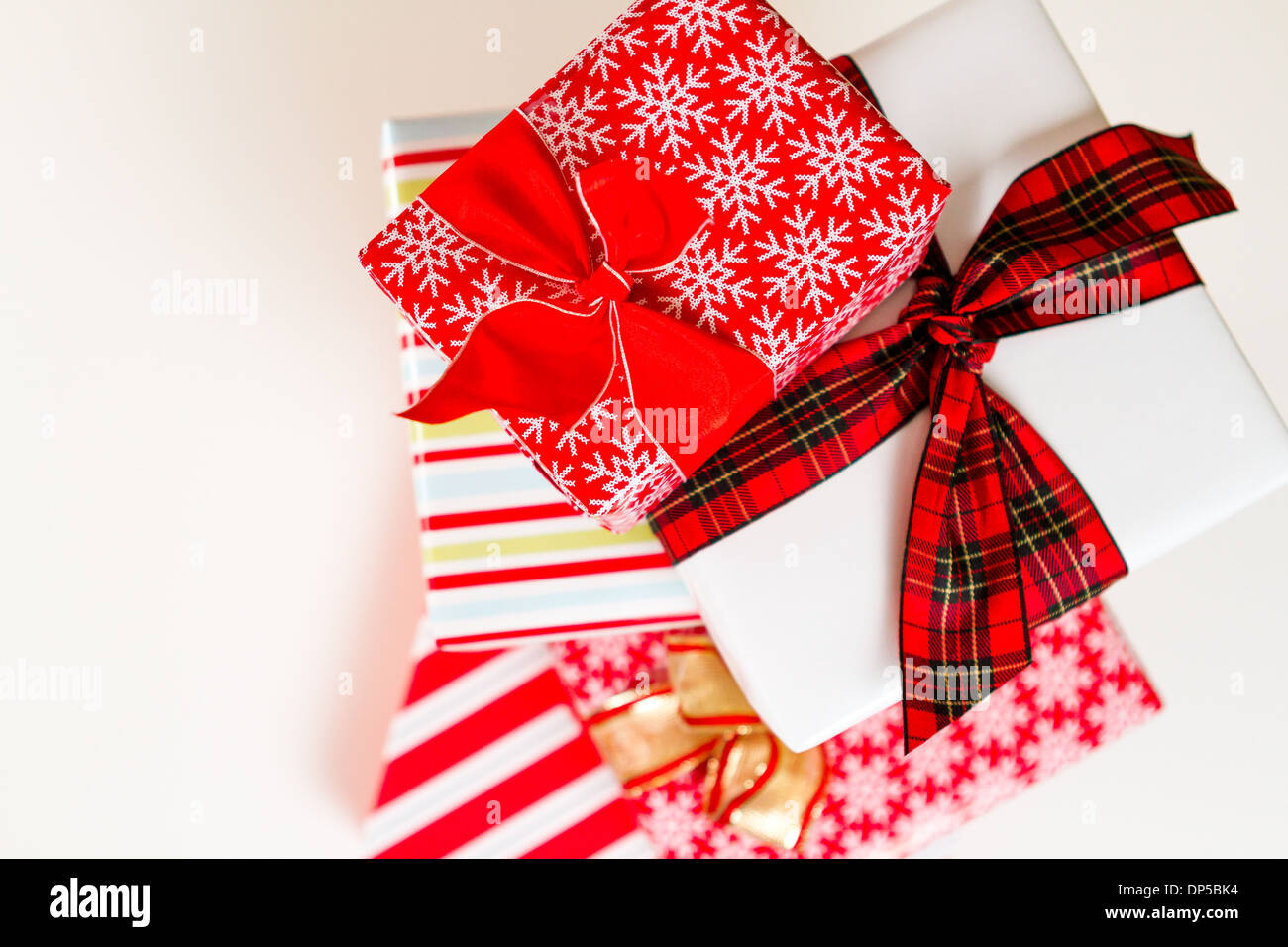 Christmas presents wrapped in colorful paper Stock Photo - Alamy